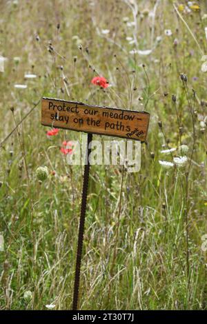 A sign protecting a wild flower meadow in Newquay Orchard a community ...