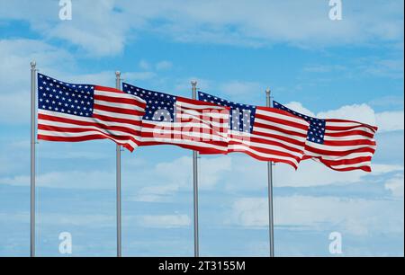 USA four flags in row waving together on blue cloudy sky, multiple ...