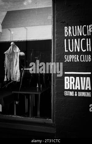 Window display with scary skeleton and skull for Halloween friday ...