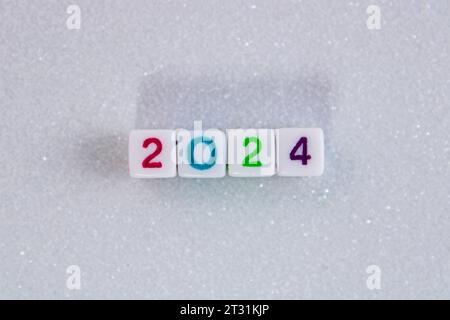 Year 2024, cubes with numbers on white glitter background Stock Photo ...