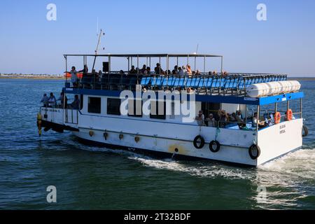 A public ferry boat leaving Olhão in Portugal Stock Photo - Alamy