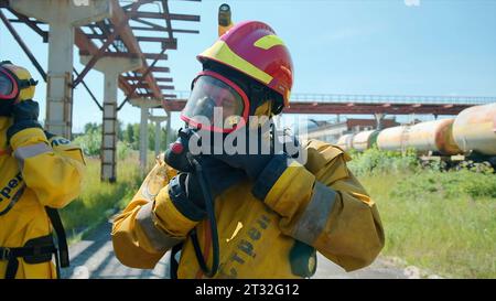 Fire safety exercises. Clip. Men in special uniforms and gas masks ...