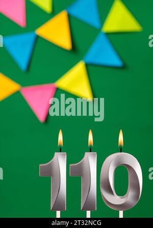 Birthday number 110 - Green birthday candle on white background Stock ...