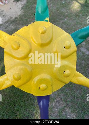 Yellow plate on monkey bars at the park close up background Stock Photo ...