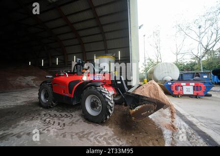National Highways staff load a winter service vehicle with salt at ...