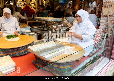 Istanbul, Turkey, Turkish women preparing turkish bread at a restaurant ...