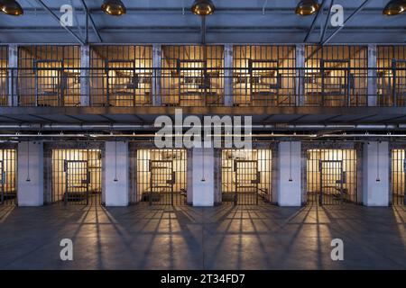 A prison hallway showcasing rows of cells. Hallway of the modern loft ...