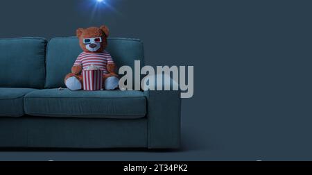 Cute teddy bear watching movies and eating popcorn Stock Photo - Alamy