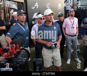 Charles Howell III of Crushers GC and his caddie wait on the 18th ...
