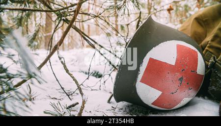 Corpsman Helmet Lies Near Fallen Soldier. Metal Helmet Of United States ...