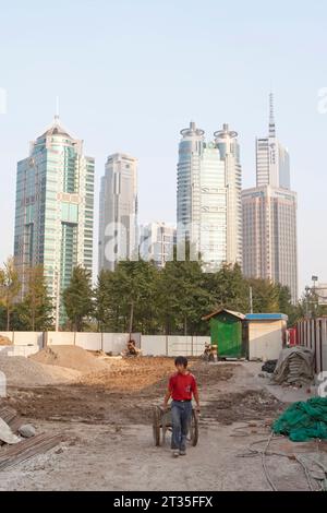 Asia China Shanghai Construction workers erect steel scaffolding at ...