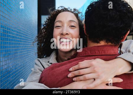 happy man and woman hugging near car at sea Stock Photo - Alamy