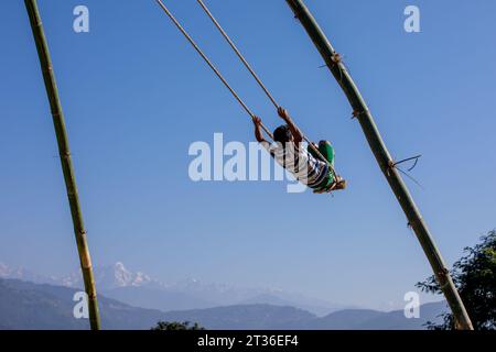 Playing swing on the precious occasion of the Dashain Festival, in ...
