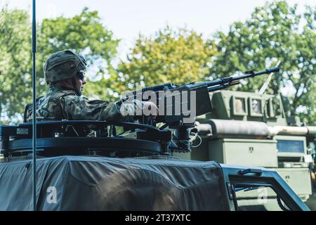 Military special forces and tank moving on the street under smoke ...