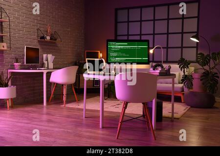 Interior of dark office with programmer's workplaces Stock Photo - Alamy