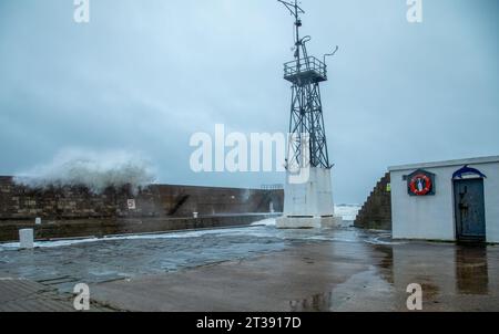 Very high waves coming over a harbour wall during a storm Stock Photo ...