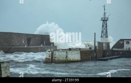 Very high waves coming over a harbour wall during a storm Stock Photo ...