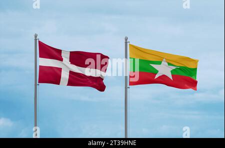 Myanmar aka Burma flag and Denmark flag waving together on blue sky ...