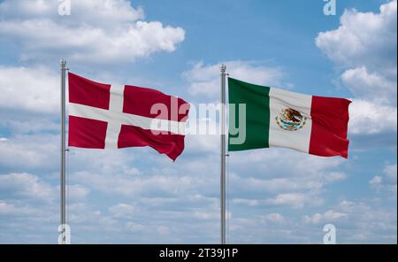 Denmark and Mexico flags waving together on blue cloudy sky, two ...