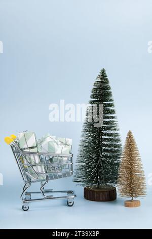 A small shopping cart is filled with gold bars placed on a textured ...
