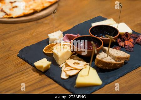 Slices of tasty pears on a ceramic saucer, close-up, on a white ...