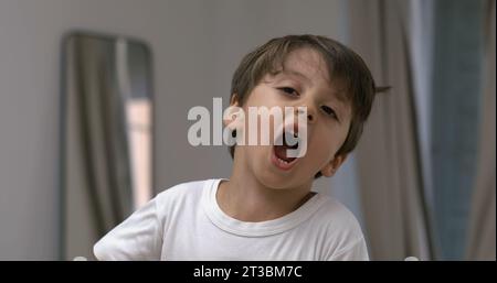 Upset child emotion in slow-motion. Close-up of angry little boy ...