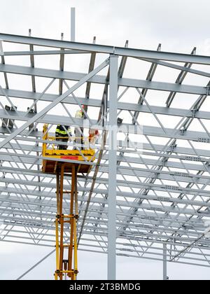 Complex large volume steel frame structure assembly using self ...