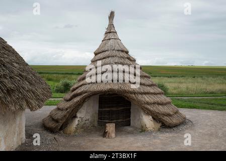 Replica Neolithic houses next to Stonehenge Stock Photo - Alamy