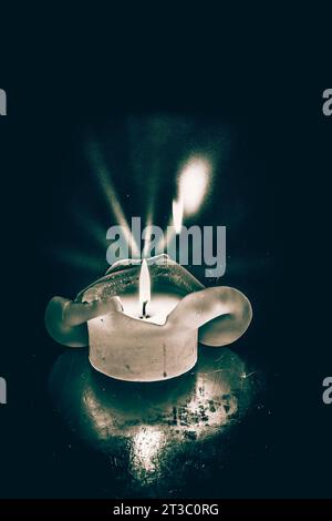 one burning candle with reflection against black background Stock Photo ...