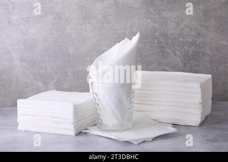 Clean paper towels and tissues on light wooden table, flat lay Stock ...