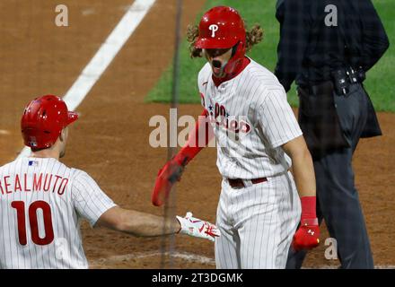 Philadelphia Phillies' J.T. Realmuto celebrates his run on an RBI ...