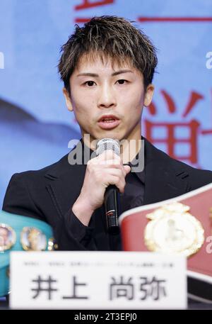 Naoya Inoue of (C) Japan attends a press conference with his trainer ...
