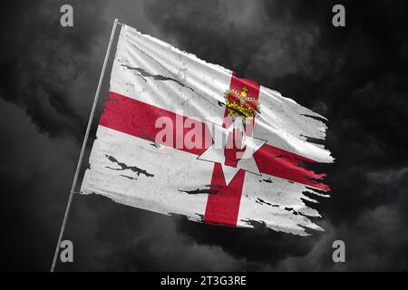 Northern Ireland torn flag on dark sky background with blood stains ...