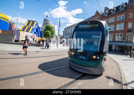 Tram passing Nottingham Beach in the Market Square, Nottinghamshire ...