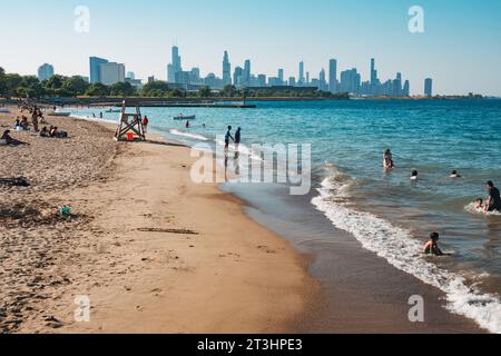 the Chicago skyline seen from 31st Street Beach. Beachgoers make the ...