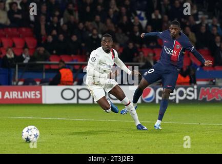 Fikayo Tomori of AC Milan takes the ball past Piotr Zielinski of SSC ...