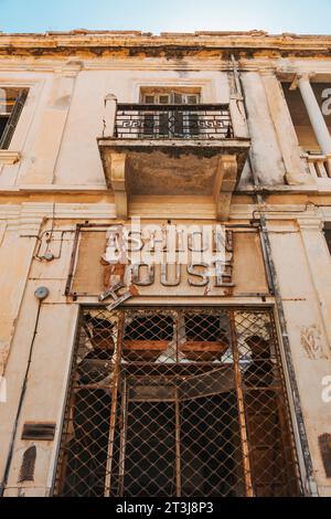an old sign above a door to a fashion shop in Varosha, a suburb in the ...