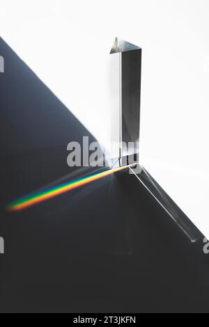 White light passing through a triangular prism, which splits the light ...