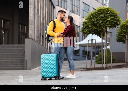 Long-distance relationship. Beautiful couple kissing on platform of railway station Stock Photo ...