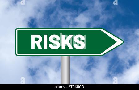 Risks road sign on cloudy sky background Stock Photo - Alamy