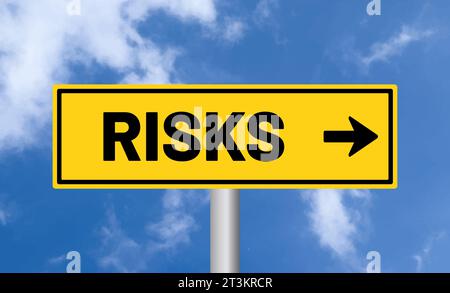 Risks road sign on cloudy sky background Stock Photo - Alamy