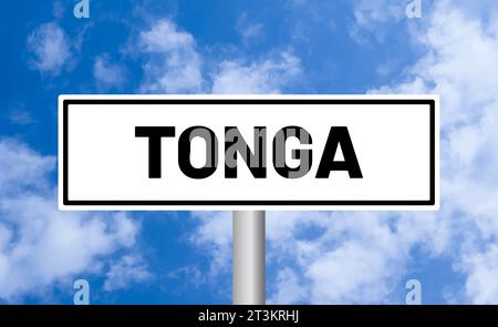 Tonga road sign on blue sky background Stock Photo - Alamy