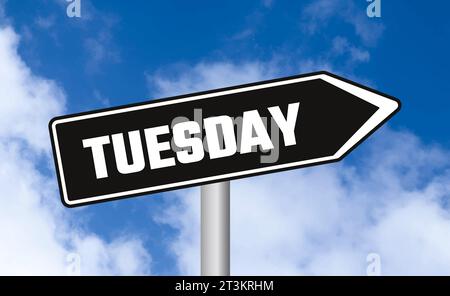 Tuesday road sign on blue sky background Stock Photo - Alamy