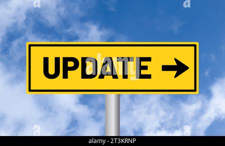 Update road sign on cloudy sky background Stock Photo - Alamy