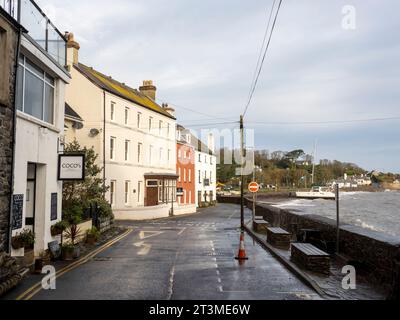 A sailing boat ripped off its moorings by storm Babet and blown onto ...