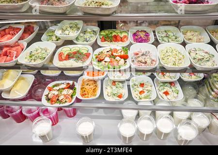 Various salads . Glass Showcase in a buffet or self-service restaurant ...
