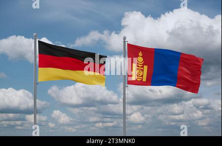 Germany and Mongolia flags waving together on blue cloudy sky, two ...