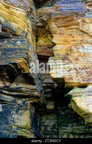 Sandstone rock and cave formation. Hopeman bay coastline, Morayshire ...