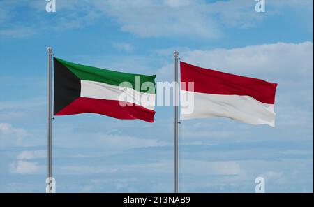Kuwait and Indonesia and Bali flags waving together in the wind on blue ...