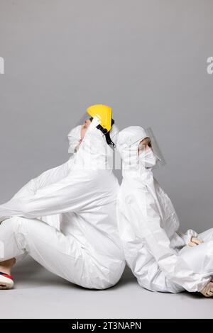 Two professional doctors together fighting against COVID-19 or ...